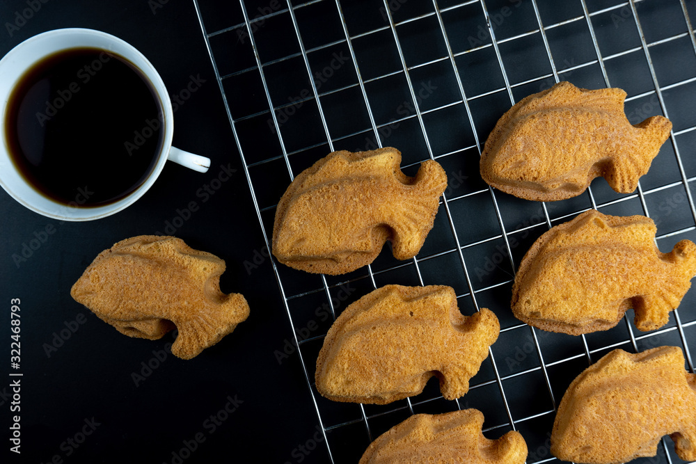 Traditional Malaysian cake called "kuih bahulu or baulu" in fish shape ...
