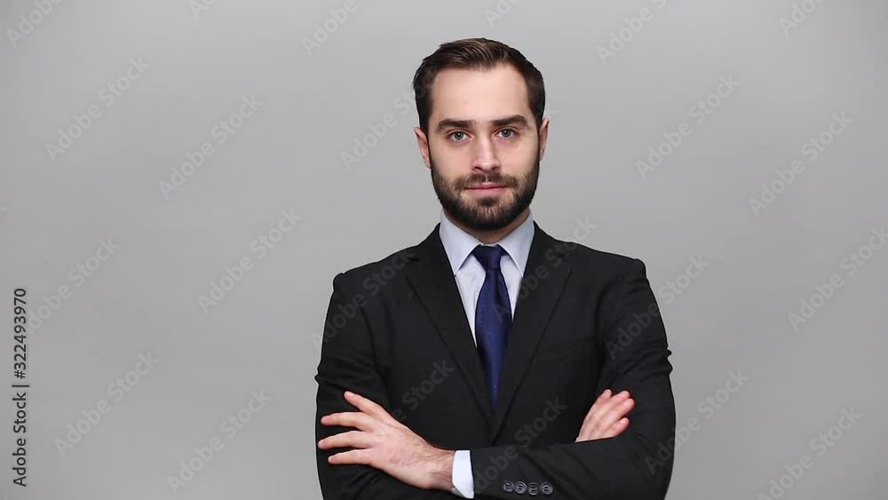 Successful young business man in classic black suit shirt tie posing ...