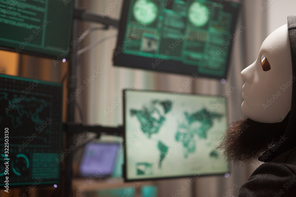 Hacker wearing a white mask to protect his identity Stock Photo | Adobe ...