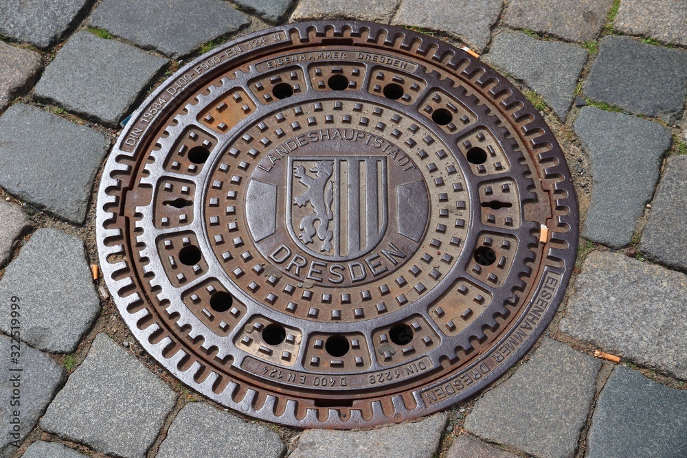 DRESDEN, GERMANY - MAY 10, 2018: Manhole cover for sewers of Dresden ...