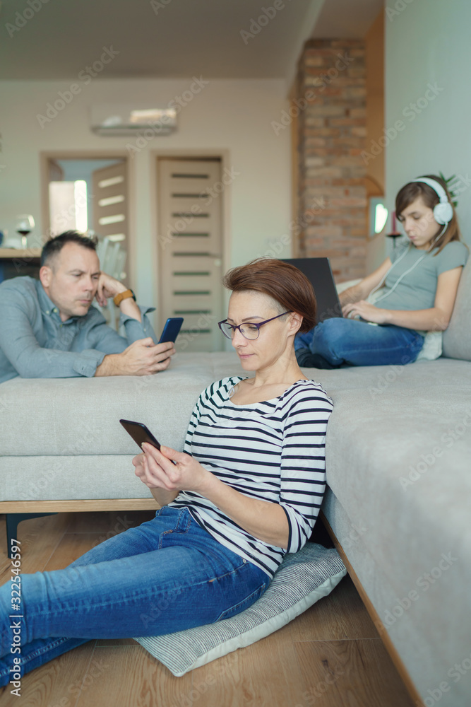 Technology addicted family: parents and child use laptop and mobile ...