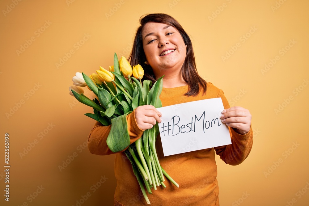 Beautiful plus size woman celebrating mothers day holding best mom ...