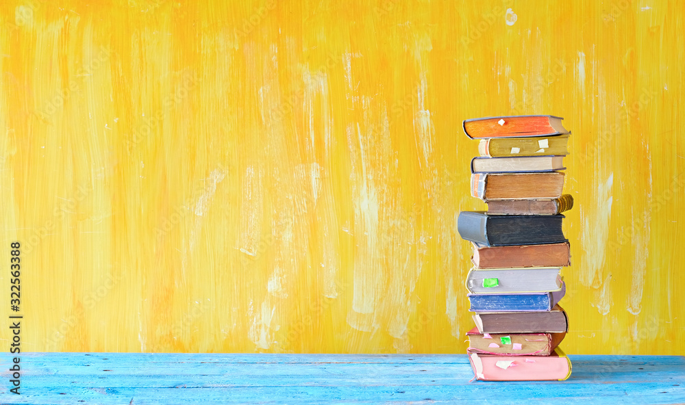 Stack of books, panorama format with large copy space. Reading ...