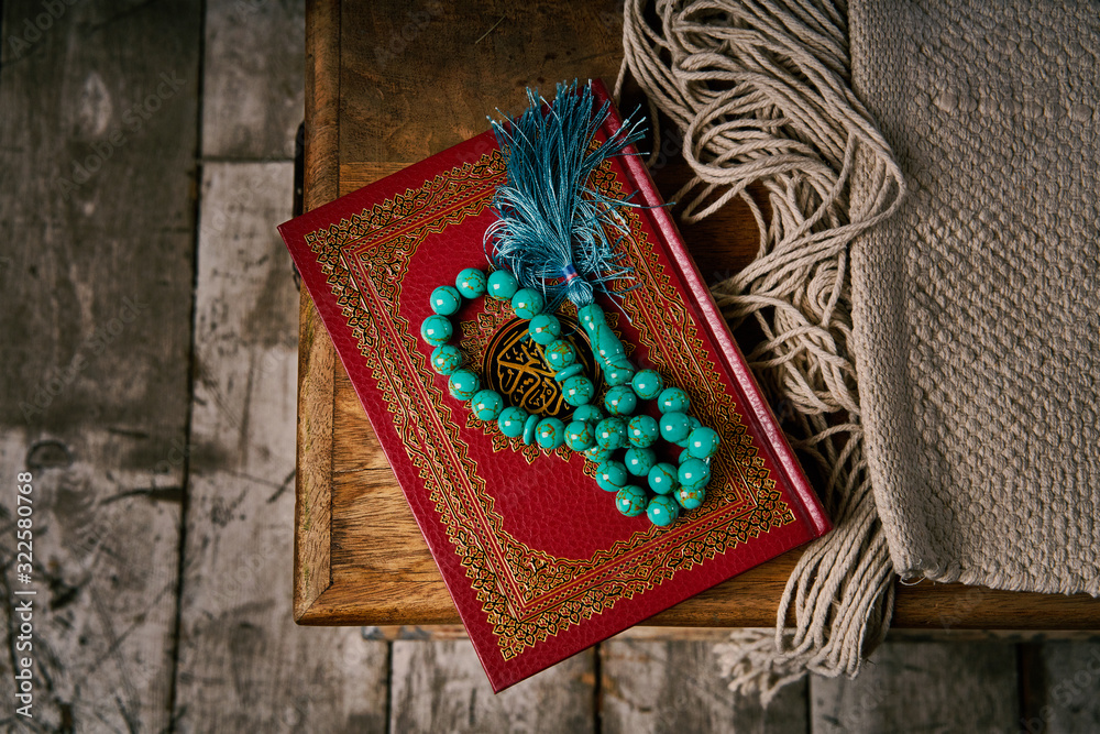 Islamic holy book Koran with rosary beads, muslim faith Allah and ...