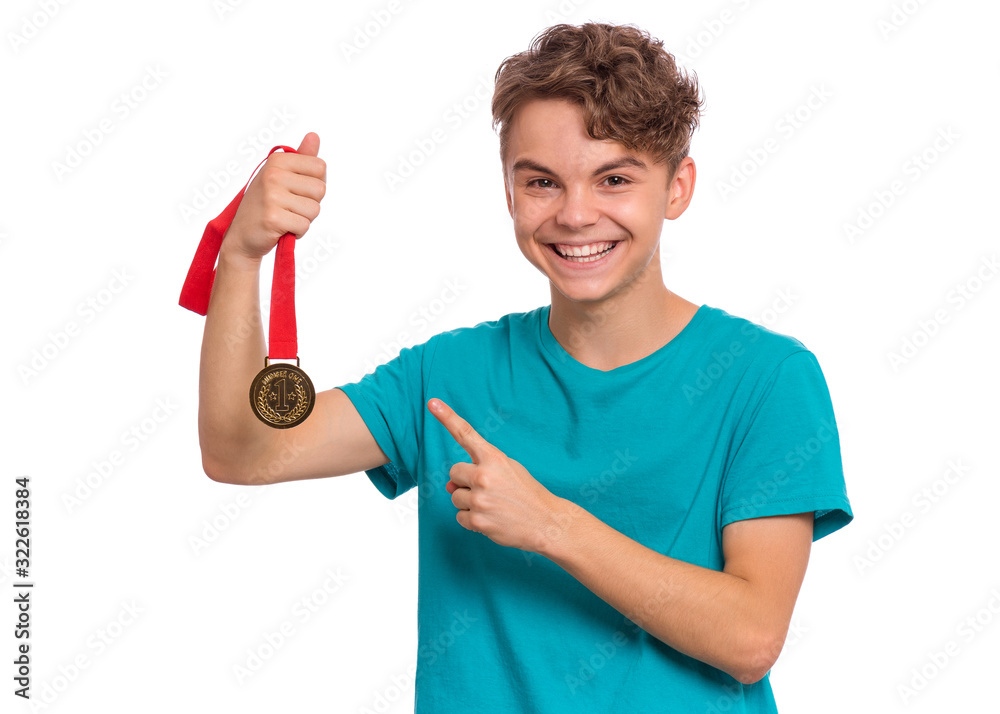 Happy winner. Portrait of Handsome Teen Boy Student holding gold Medal ...