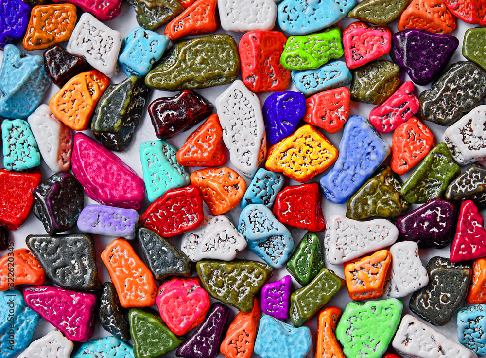 Colorful stone texture background; a variety of shapes and colors, in a ...