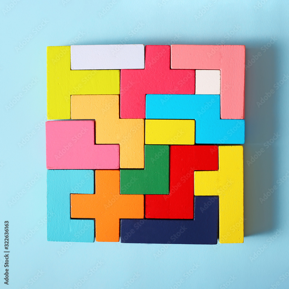 Wooden tangram cubes as a symbol of riddle Stock Photo | Adobe Stock