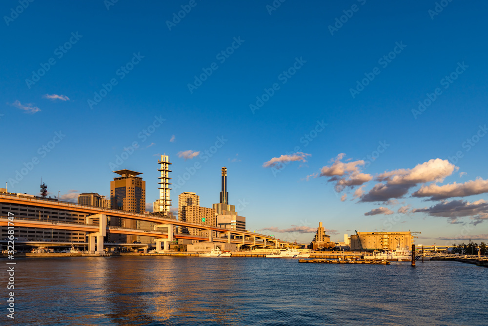 Port of Kobe city skyline view in sun set time with clear blue sky ...
