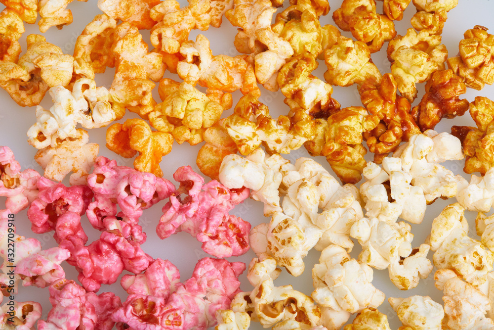 Different flavors of popcorn (cherry, caramel, salted, cheese tastes ...