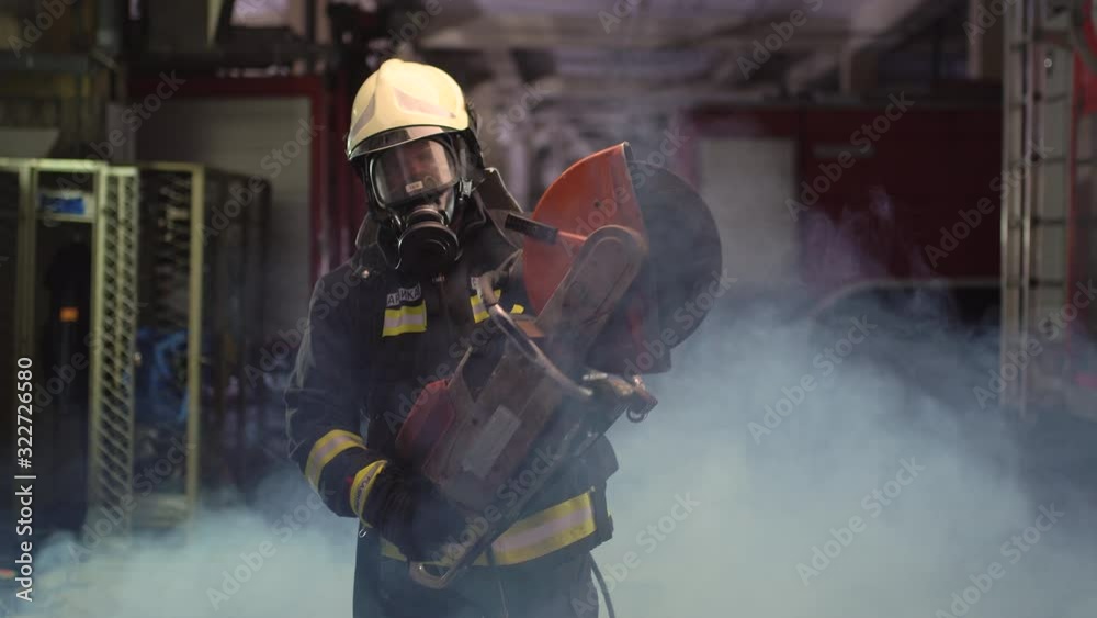 firefighter portrait wearing full equipment, oxygen mask, and power ...