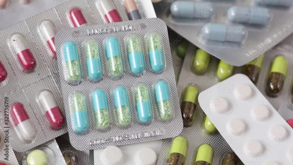 Closeup pile of medicine pills in their blisters rotating Stock Video ...