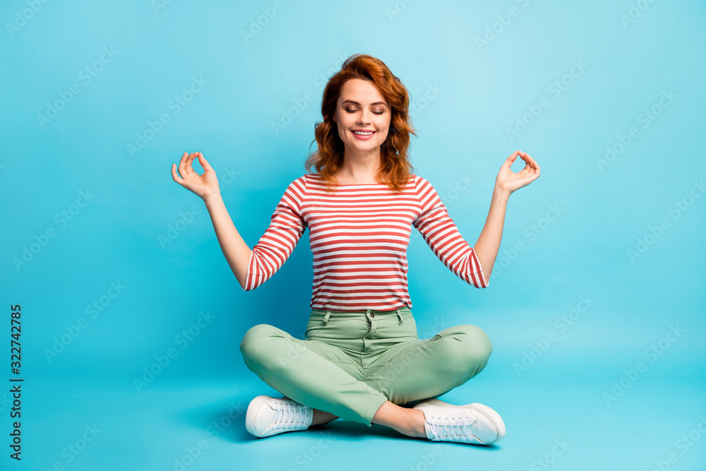 Full body photo of positive calm woman sit crossed legs meditate yoga ...