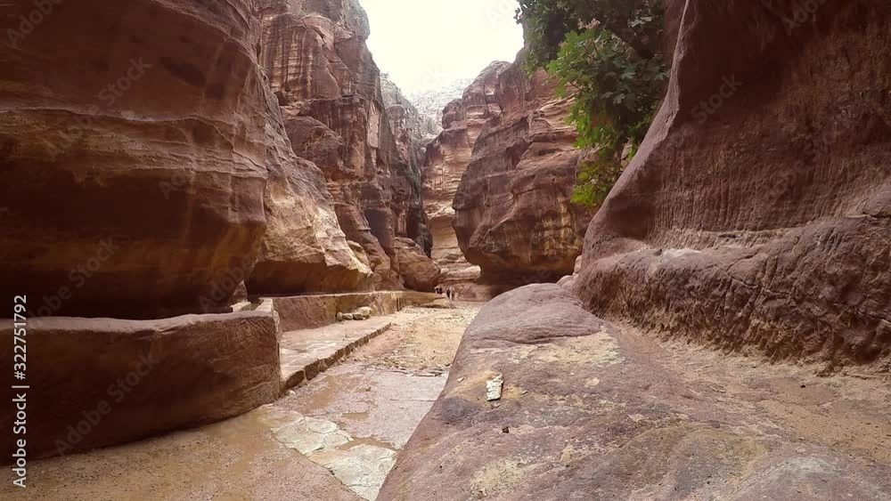 Turists walking Inside Canyon - narrow passage, gorge that leads to Red ...