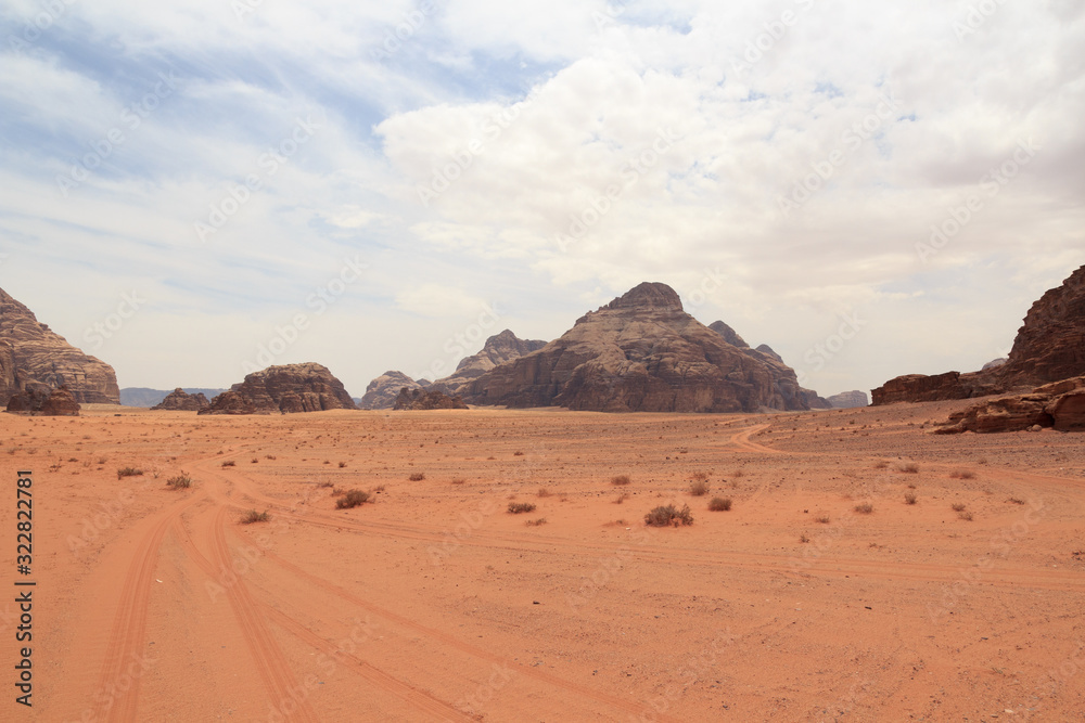 Wadi Rum desert panorama with dunes, mountains and sand that looks like ...
