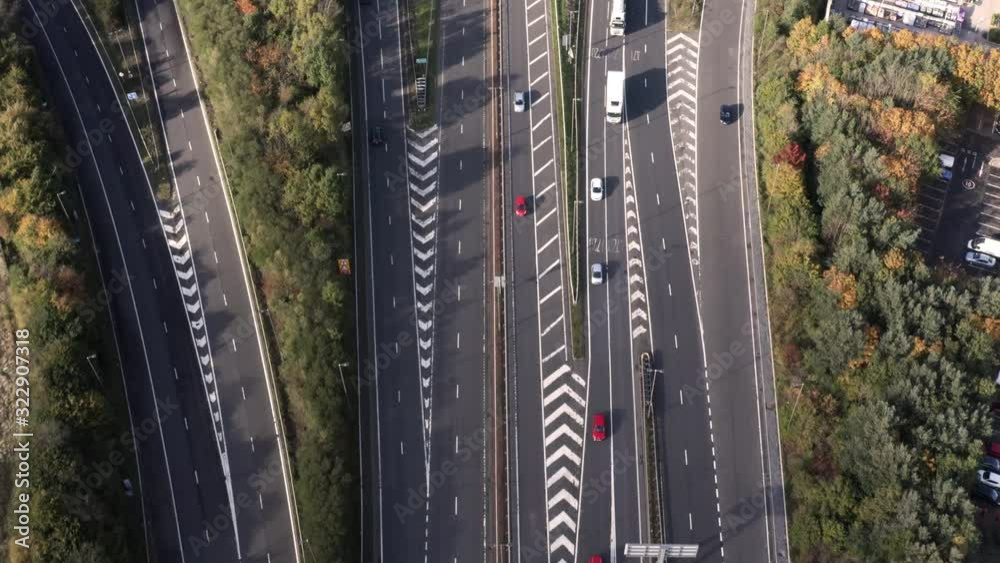 Helicopter police-chase style, bird's eye view of a busy motorway ...
