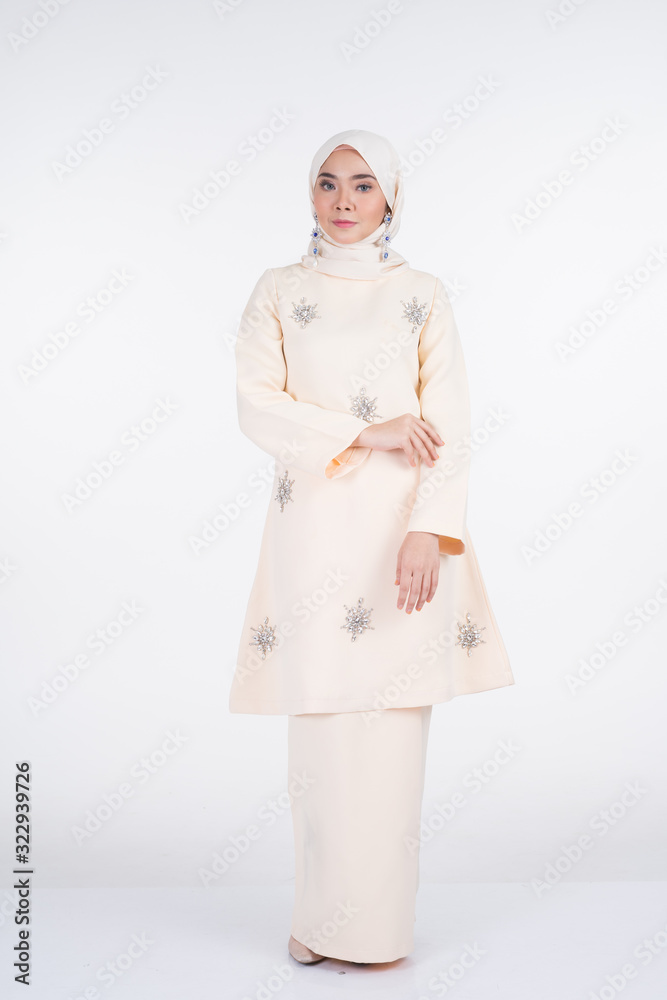 Beautiful female Muslim model in various poses wearing kurung Pahang ...