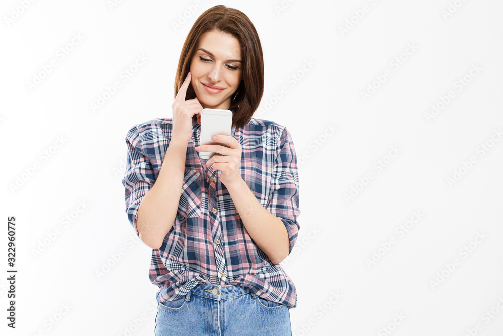 Beautiful smiling young woman holding a smart phone while text ...
