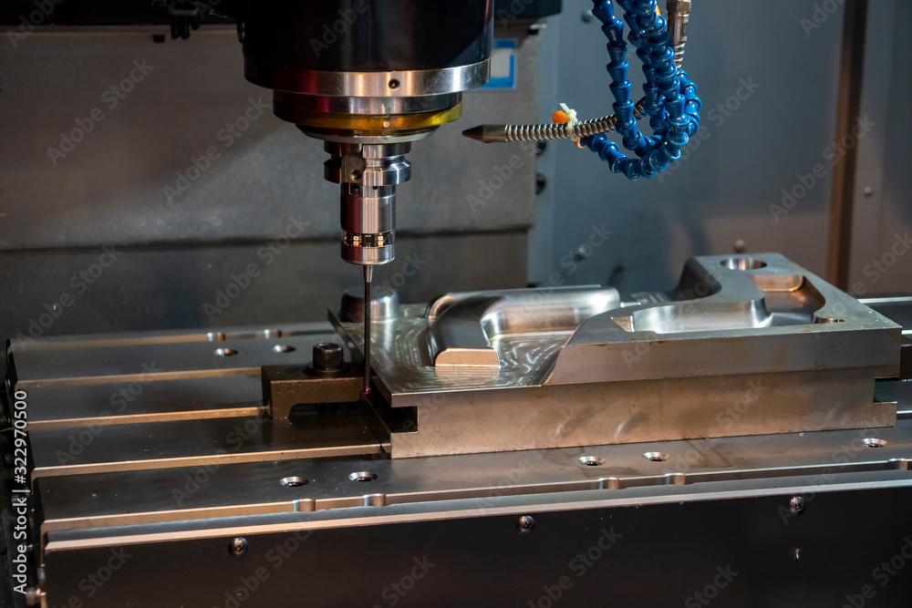 The CMM machine measuring dimension of the injection mold parts .The ...
