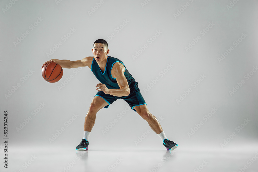 Young basketball player of team wearing sportwear training, practicing ...