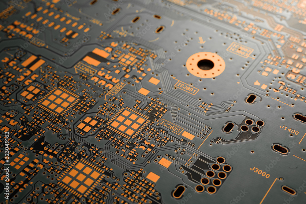 A close-up of black blank Printed circuit board (PCB) with no component ...