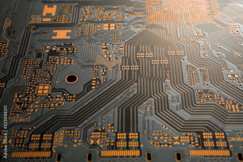 A close-up of black blank Printed circuit board (PCB) with no component ...