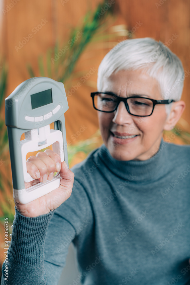 Using Hand Dynamometer for Grip Strength Test Stock Photo | Adobe Stock