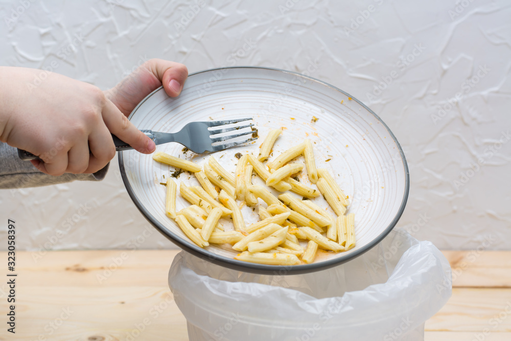 Stop wasting food. Leftover lunch is dumped in the bin. Food waste ...