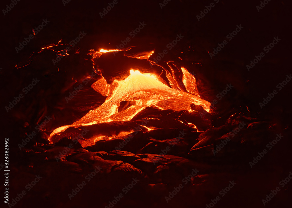 Detailed view of an active lava flow, hot magma emerges from a crack in ...
