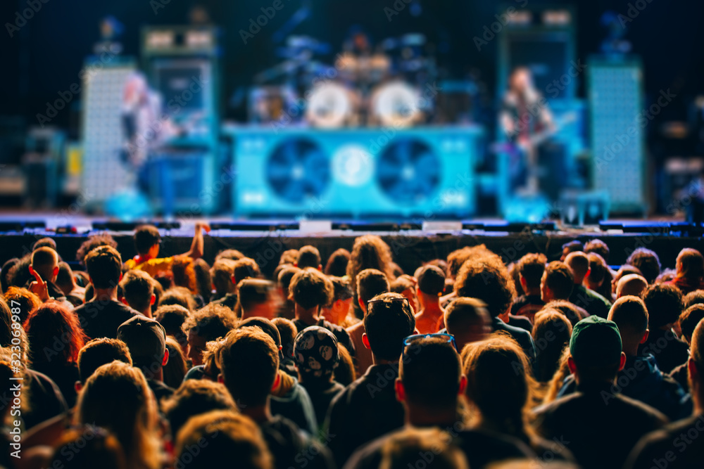 Concert and music festival background with hands raised and party ...