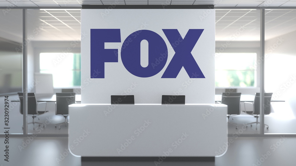 FOX CORPORATION logo above reception desk in the modern office ...