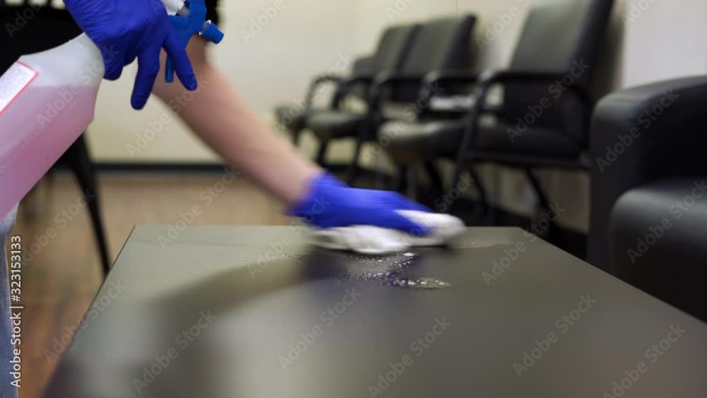A janitor custodian woman cleaning doctors office medical area in ...