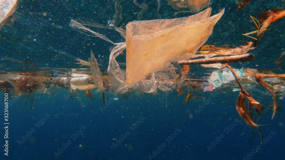 Trash in sea water, plastic pollution problem in tropical waters of ...