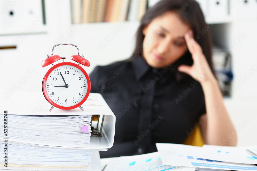 Tired and exhausted chinese woman have a lot of work with documents ...