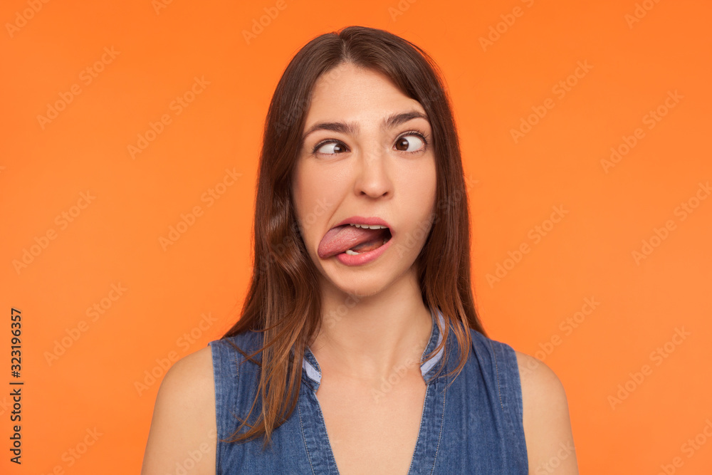Closeup Of Silly Dumb Brunette Woman Demonstrating Tongue And Making