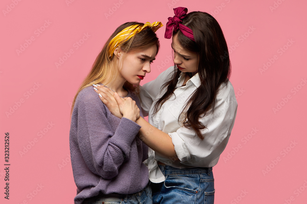 Picture of stylish beautiful young woman giving support to her stressed ...