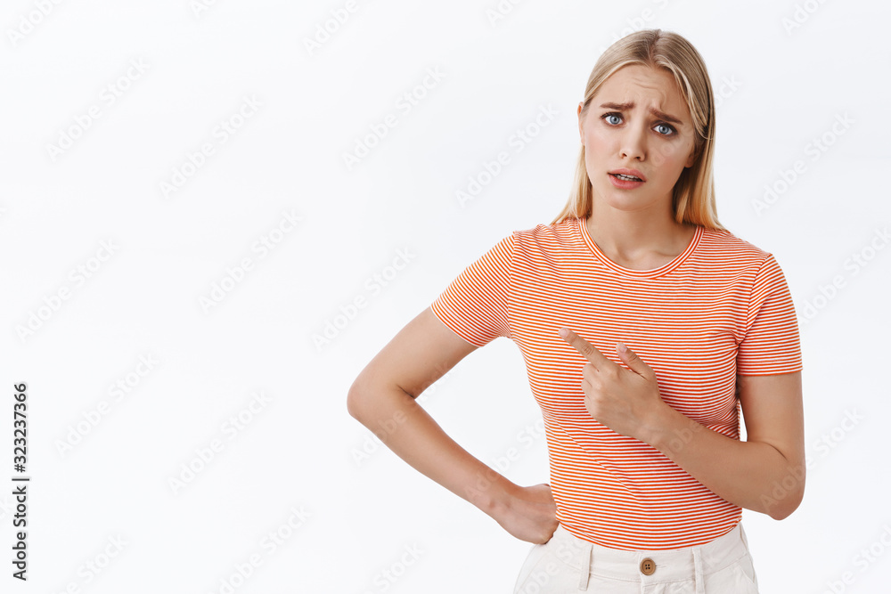 Disappointed and slightly upset gloomy cute blond girl, whining ...