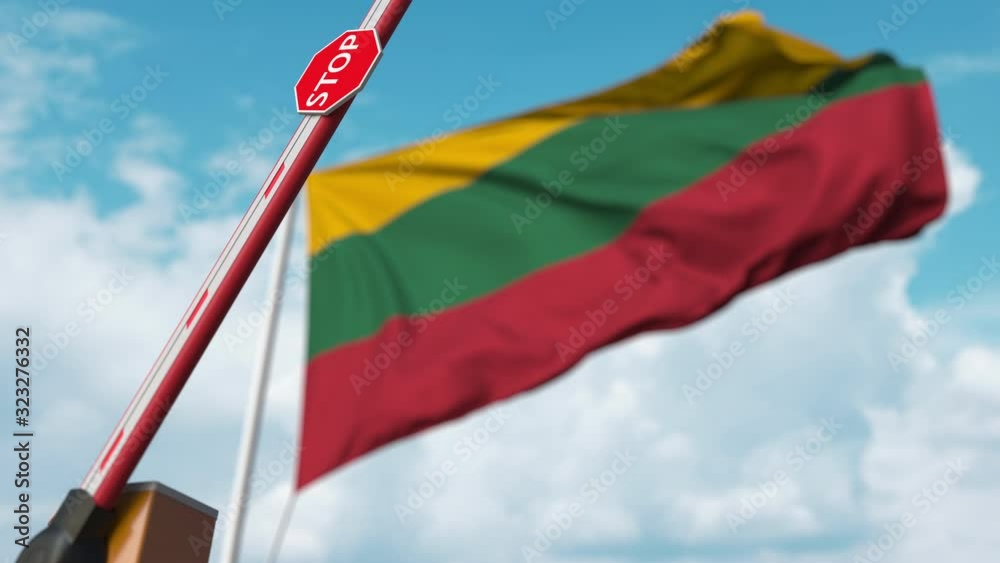 Opening boom barrier with stop sign against the Lithuanian flag. Free ...