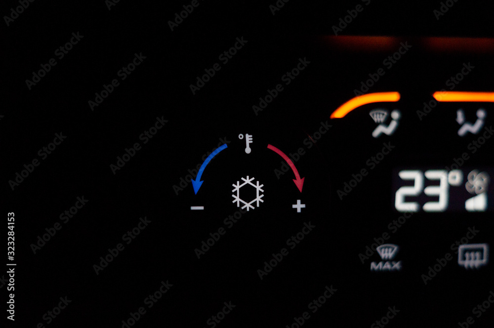 climate control unit in a modern car is highlighted in the dark Stock ...