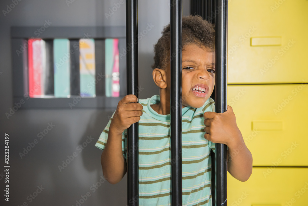31.07.2017 - Kyiv, Ukraine. Little boy in prison in playroom. Kid ...