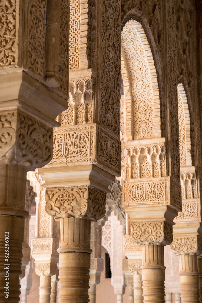 Arabic architectural details in columns and arches of a mosque or an ...