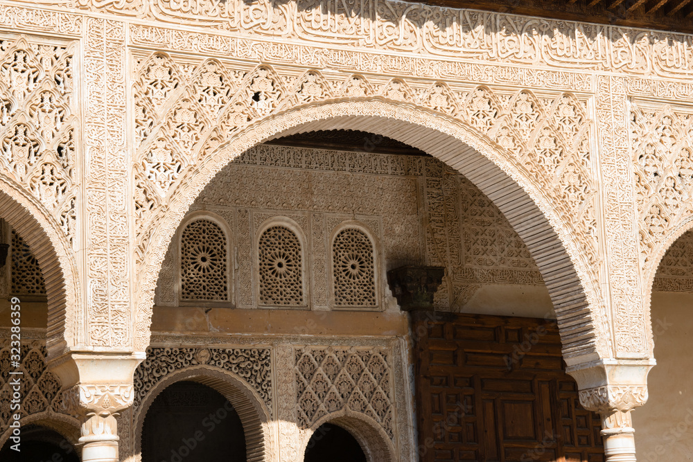 Arabic architectural details in columns and arches of a mosque or an ...