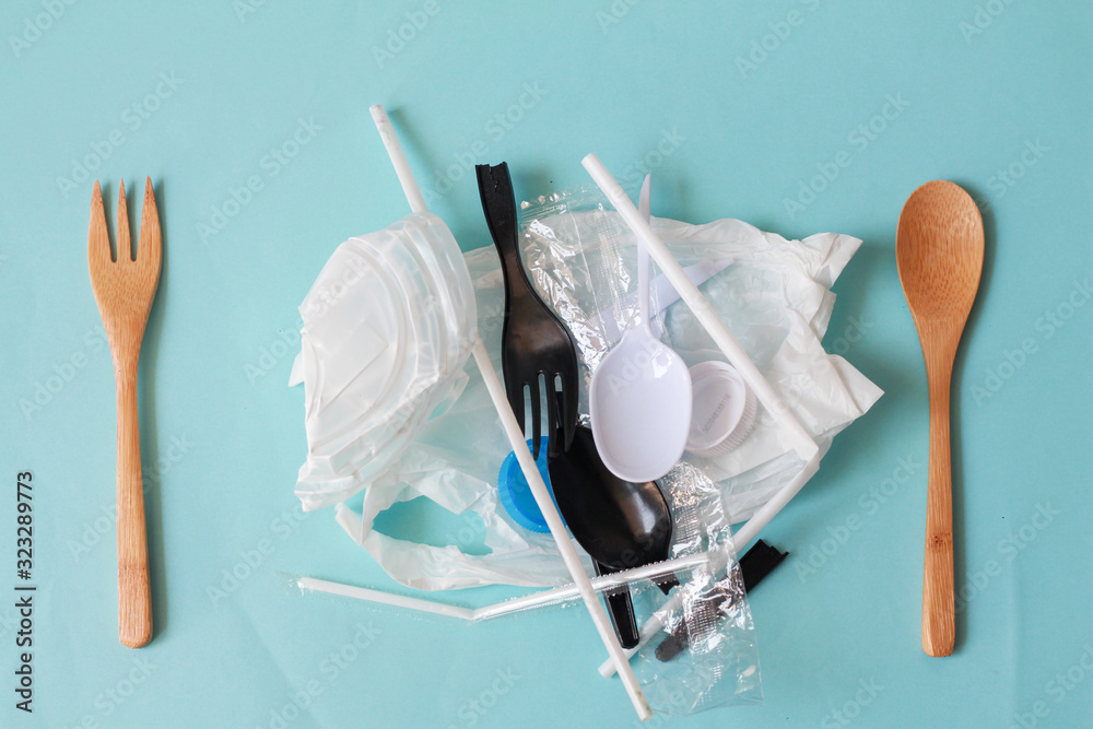fork and spoon with plastic trash.The concept of environmental ...