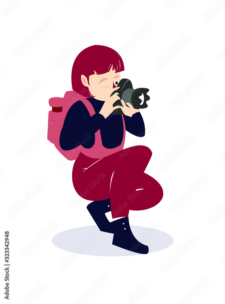 Photographer with red hair and backpack, takes photographs with her ...