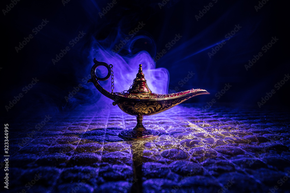 Lamp of wishes concept. Antique Aladdin arabian nights genie style oil ...