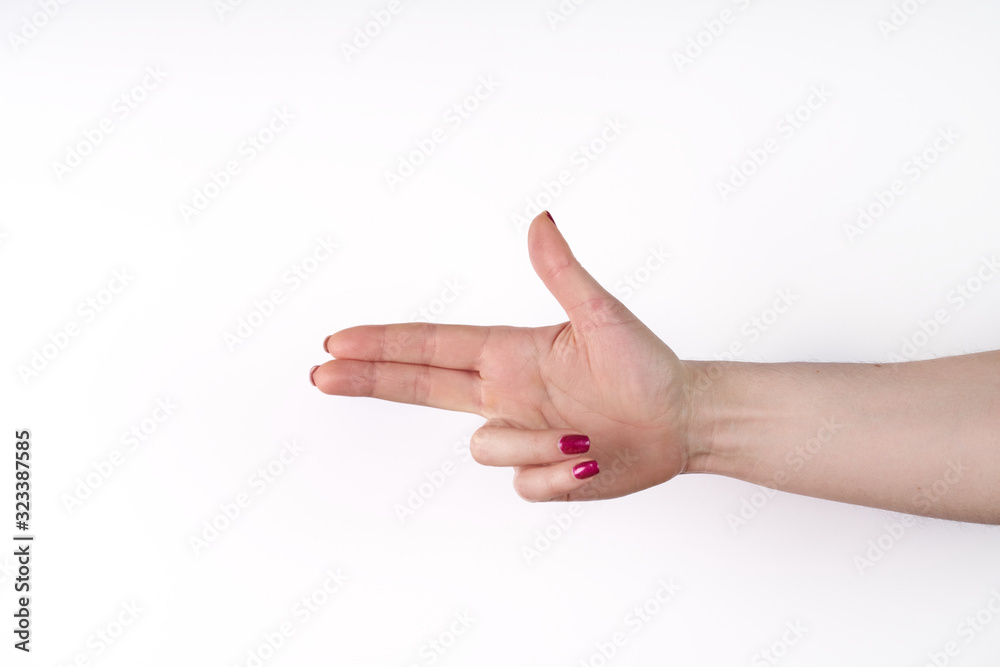 Woman's hand making shooting gun, gesture. hand pistol gesture on ...
