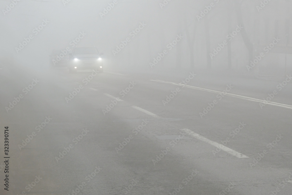 Fog weather and highway in city. Car Driving in Dense Fog. Dangerous ...