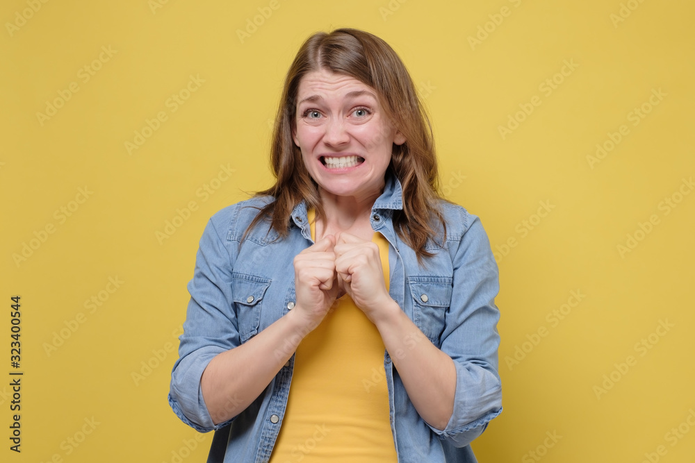 Awkward caucasian woman feeling embarrassed, confused nervous before ...