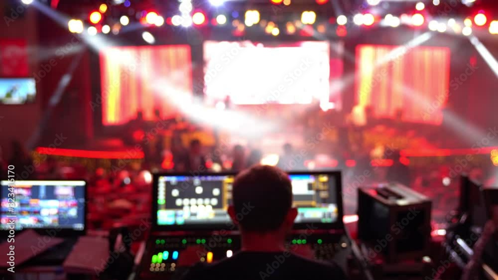 The lighting engineer sets up the controllers on the remote control ...