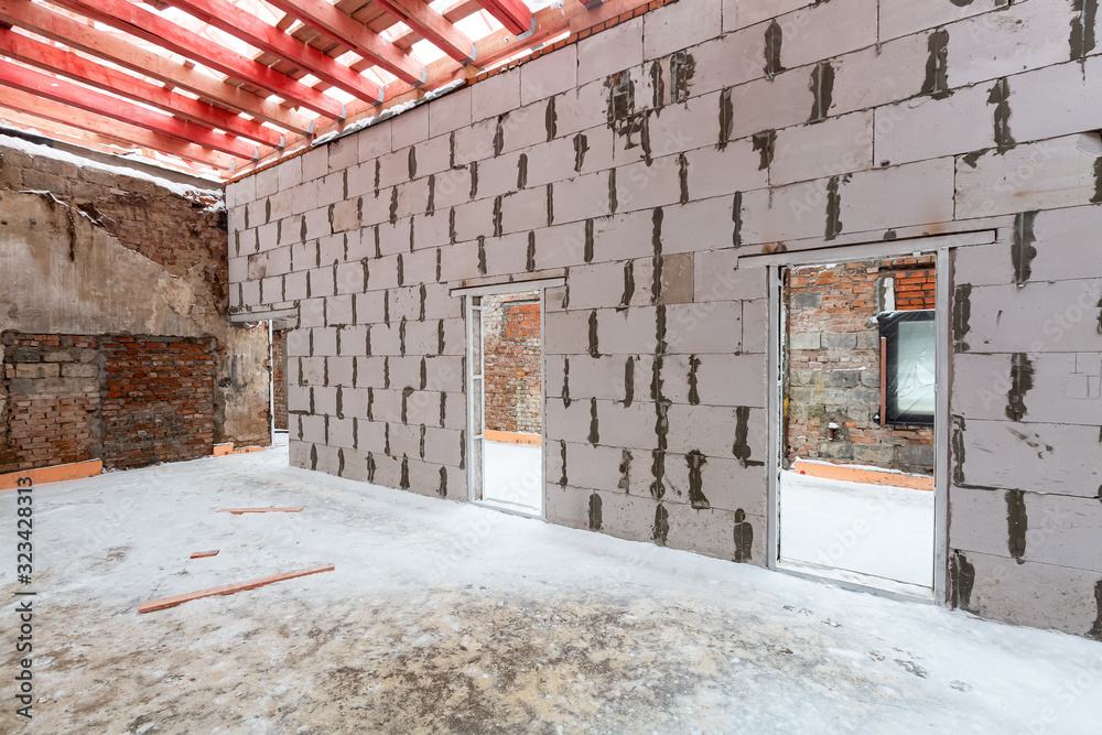 Inside view of working process of building house with wall made from ...