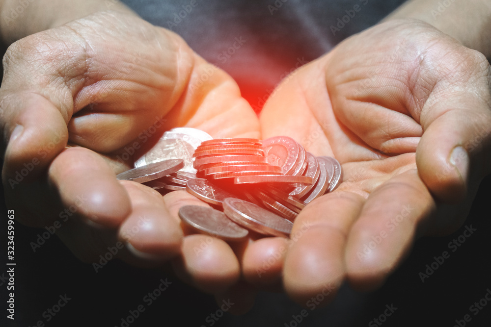 Coins in hand With men hand dividend yield, finance concept and saving ...